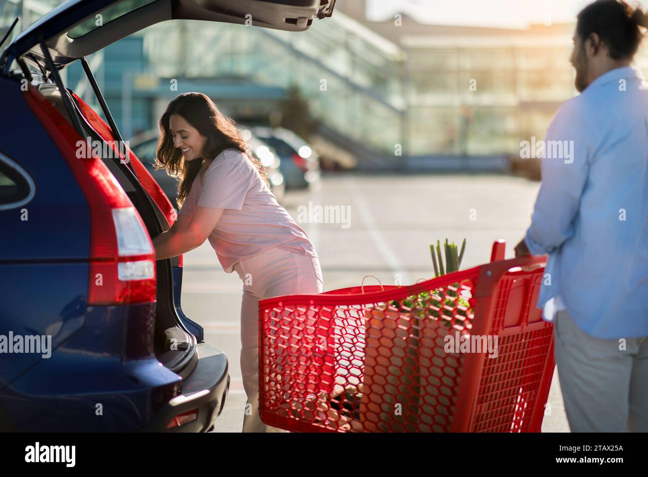 Woman shopping cart road hi-res stock photography and images - Alamy