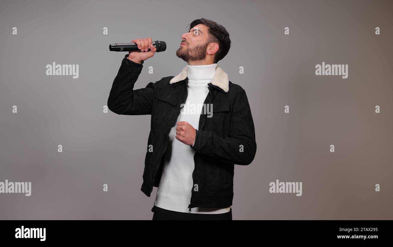 Holding microphone stand hi-res stock photography and images - Alamy