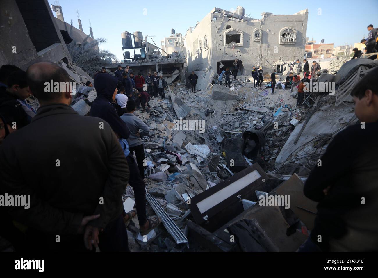 Rafah, Gaza. 02nd Dec, 2023. Palestinians stand amid the rubble of a ...
