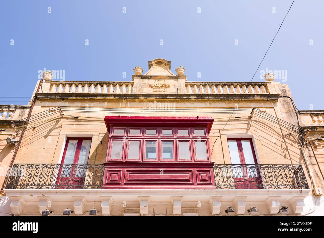 Typical red closed balconies by the name gallarija on the island of ...
