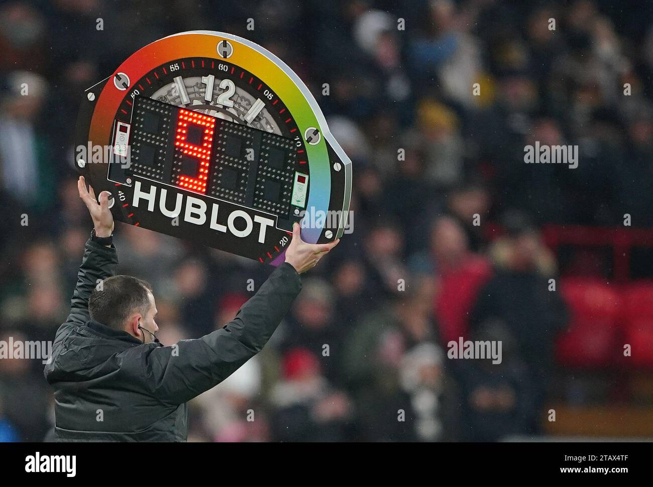 The fourth official holds up a board showing 9 additional minutes of ...