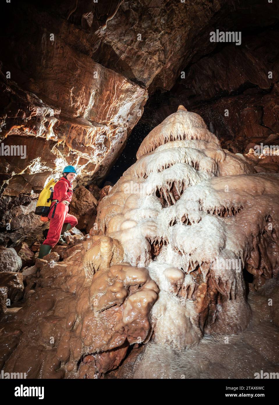 Female caver admiring cave formations, Somerset, Mendip, UK Stock Photo ...
