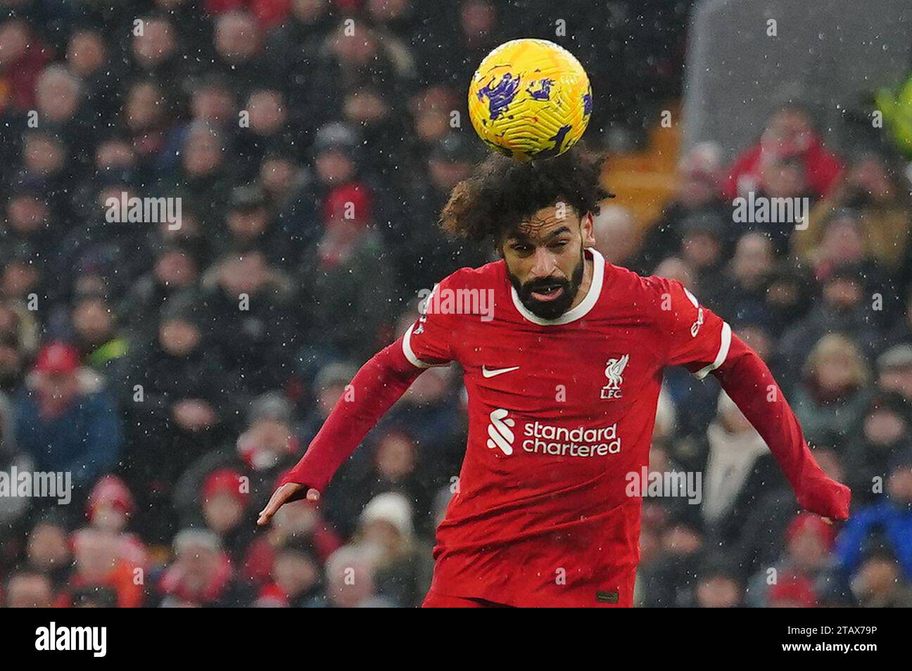 Liverpool's Mohamed Salah heads a ball during the Premier League match ...