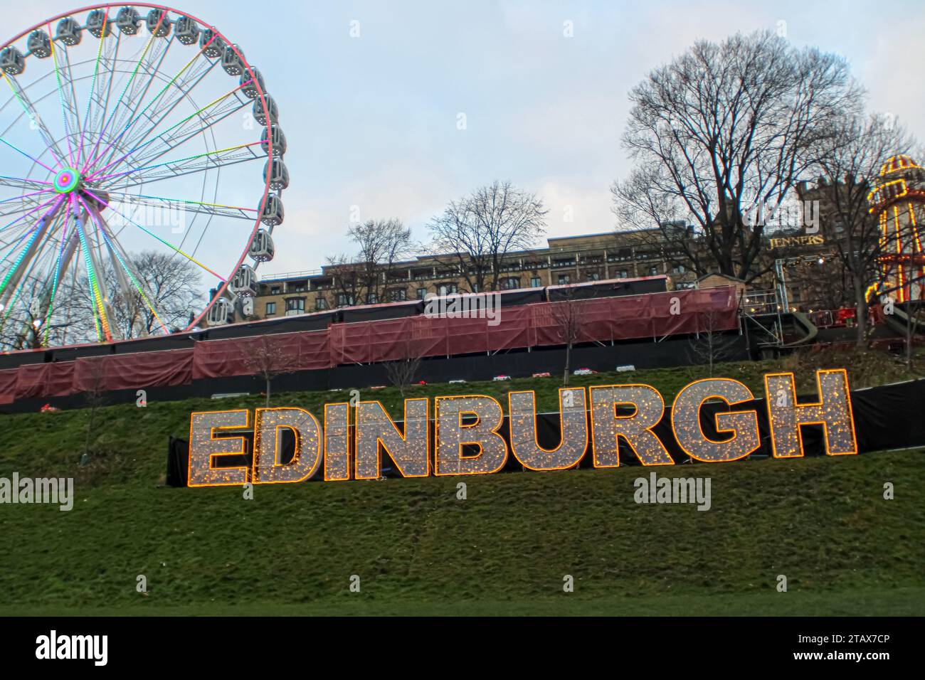 Edinburgh Sign With Glowing Lights and Ferris Wheel in the Background ...