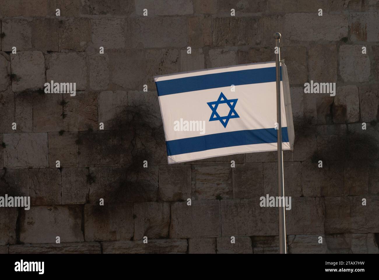 The official flag of the State of Israel with blue and white stripes ...