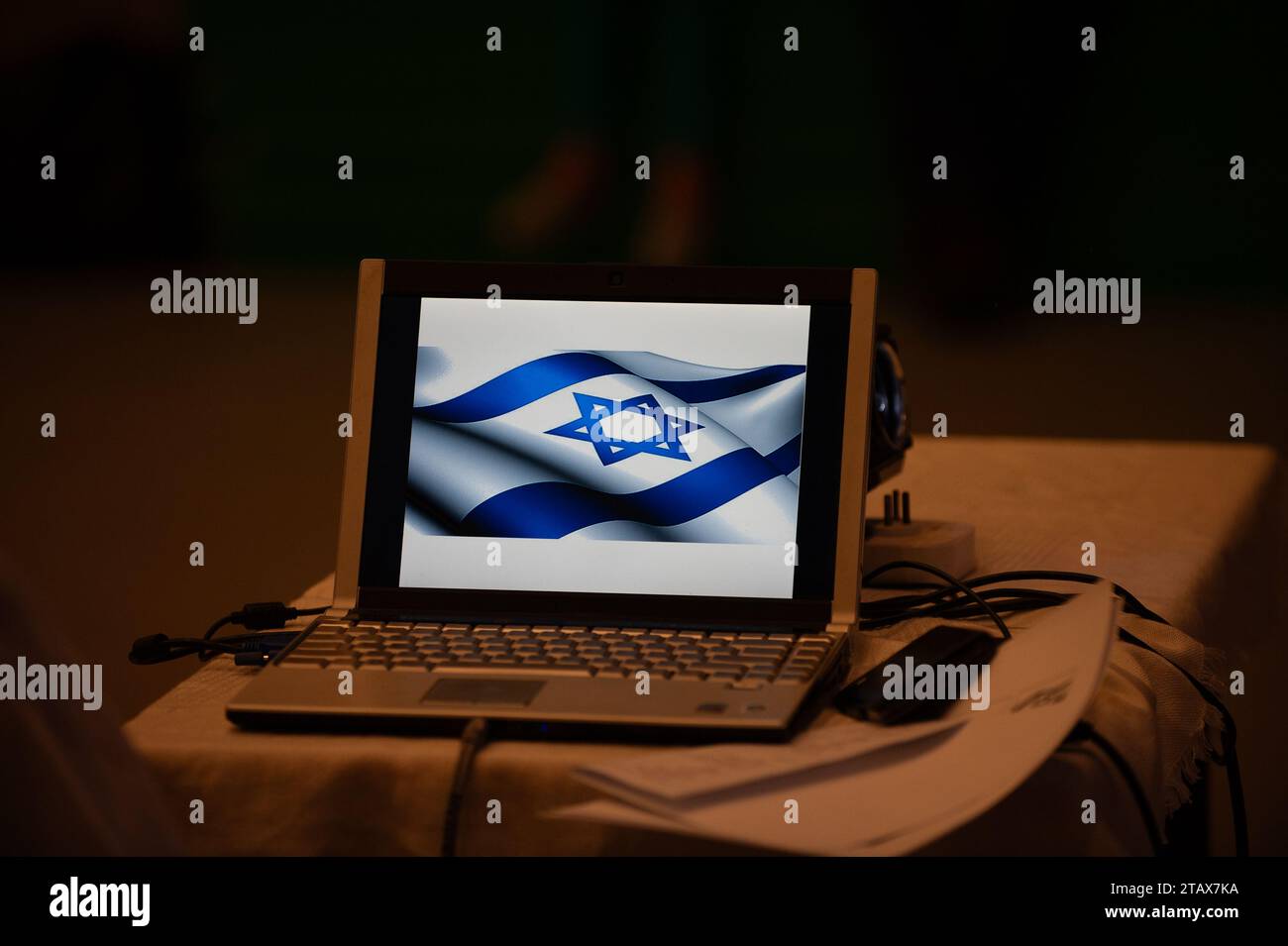 Blue and white Israeli flag is displayed on the screen of a laptop ...