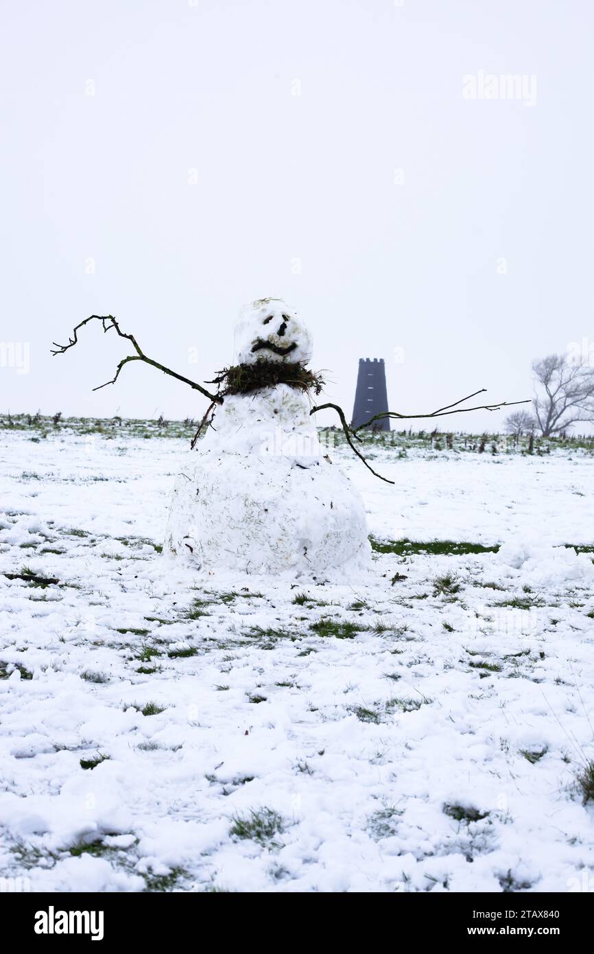Festive scene with Snowman on white over morning, first proper snow ...