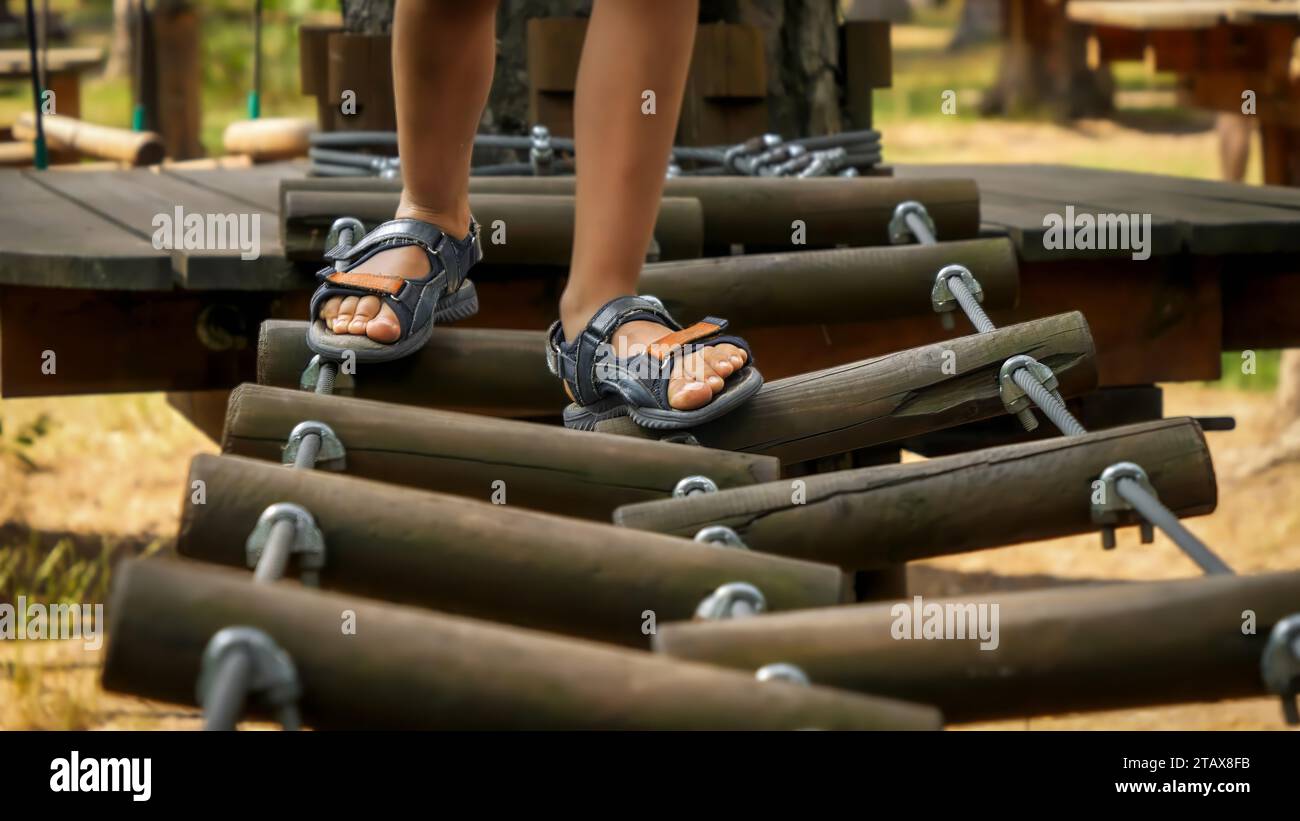 Children climbing tree feet hi-res stock photography and images - Alamy