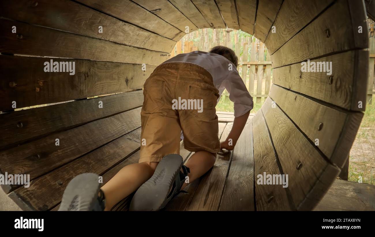 Child crawling through tunnel hi-res stock photography and images - Alamy