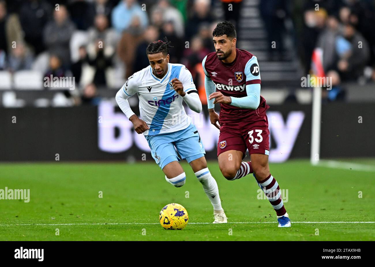 London, UK. 3rd Dec, 2023. Emerson Palmieri (West Ham) and Michael ...