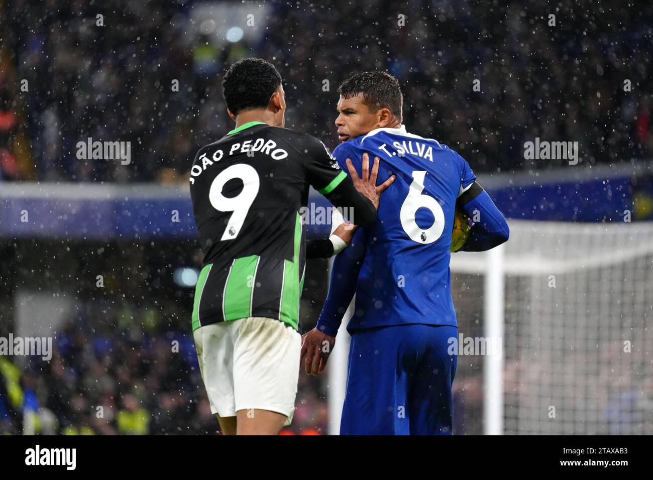 Brighton and Hove Albion's Joao Pedro pushes Chelsea's Thiago Silva in ...