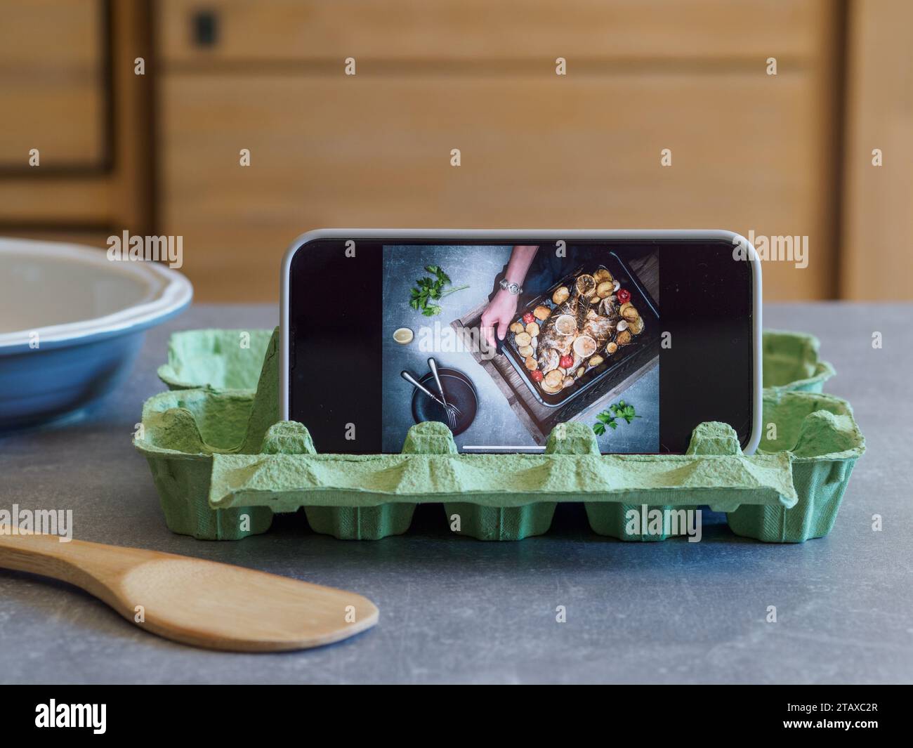 DIY smartphone stand made from egg carton. Recipe for cooking. Kitchen ...