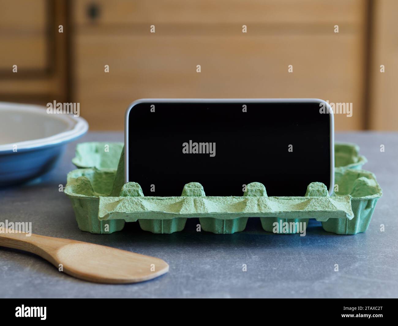 DIY smartphone stand made from egg carton. Recipe for cooking. Kitchen ...