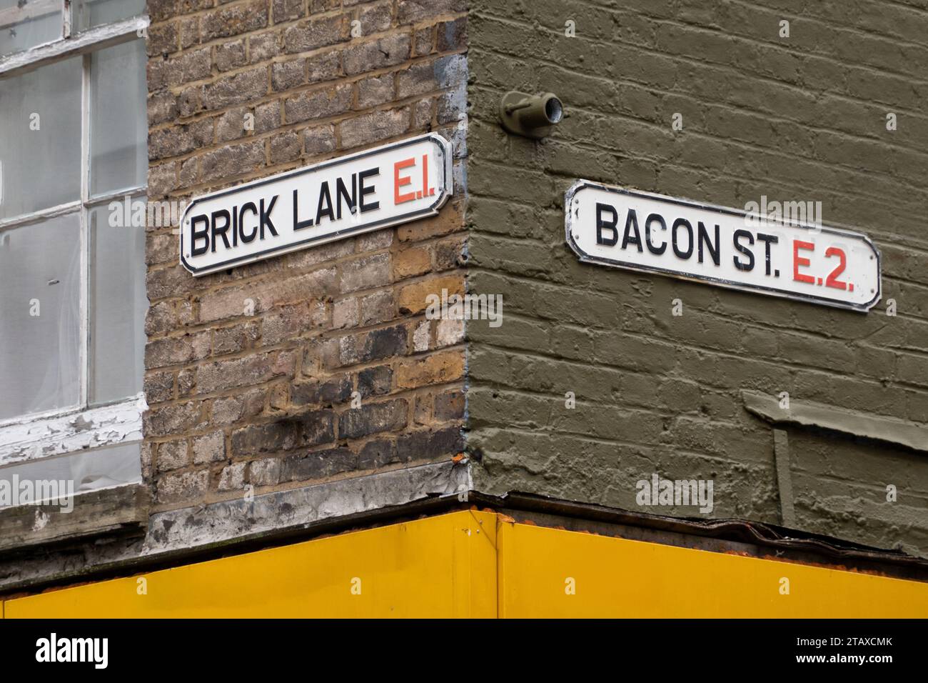Street signs, attached to buildings signposting, the corner of the ...