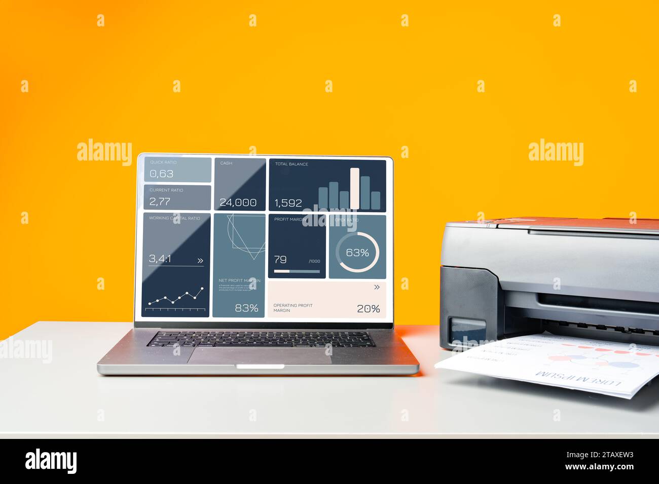 Laser printer and laptop on desk against yellow background Stock Photo ...