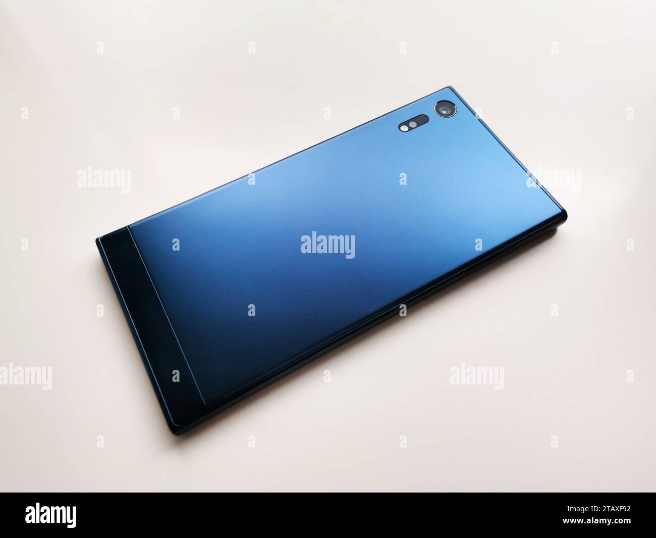 Back side of cobalt blue smartphone mockup isolated on white background ...