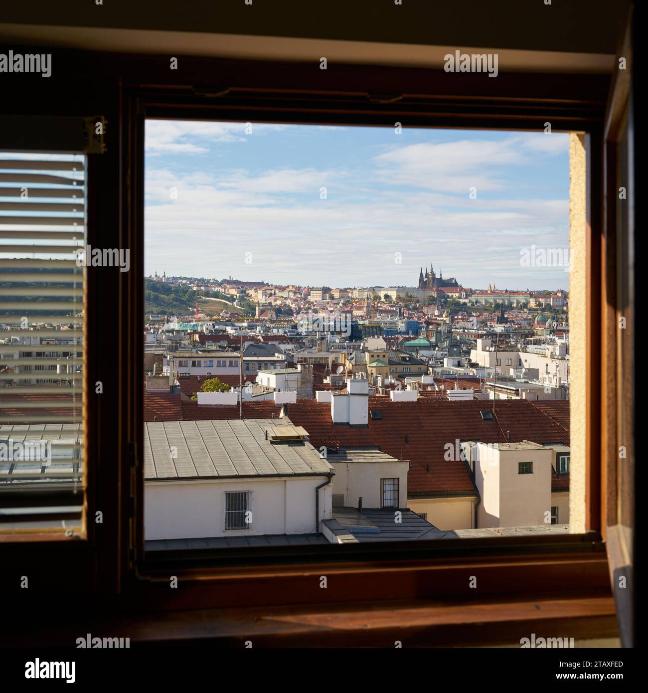 View through a open window over the old town of Prague with Prague ...
