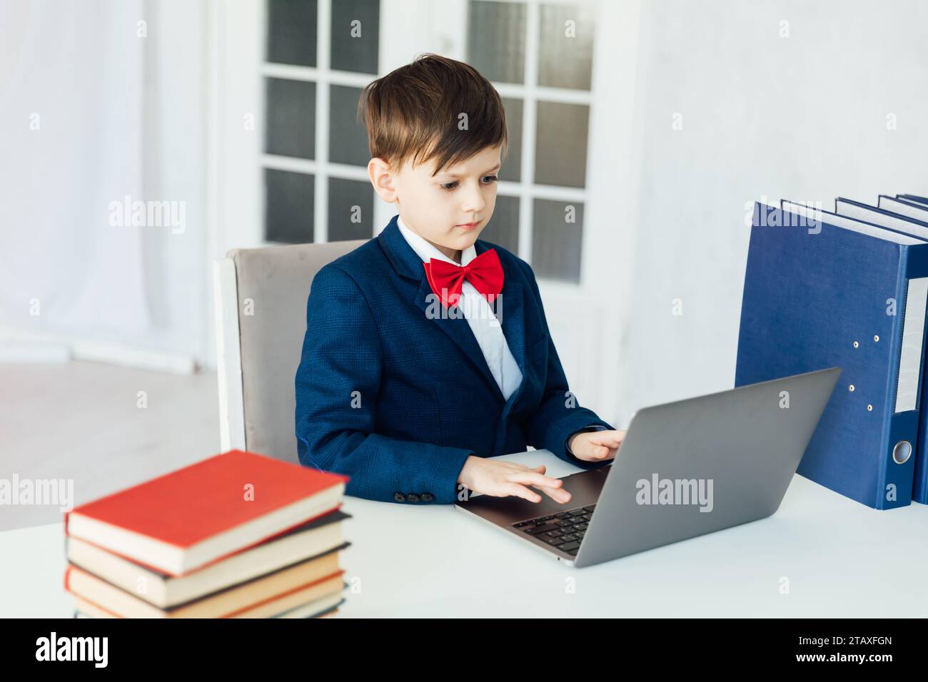 Distance learning boy learns hi-res stock photography and images - Alamy