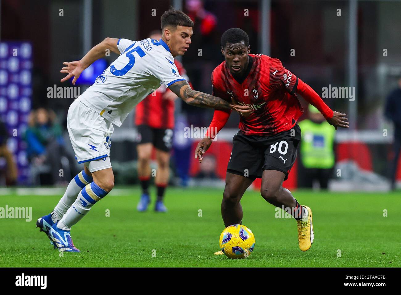 Milan, Italy. 02nd Dec, 2023. Yunus Musah of AC Milan (R) and Enzo Barrenechea of Frosinone ...