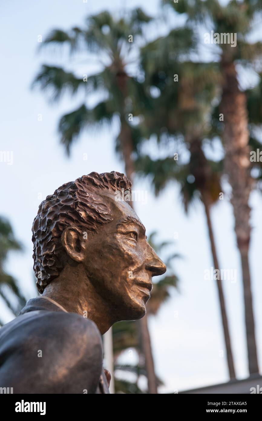 Cannes France - May 2 2011; Bronze statue on display outdoors of man 's ...