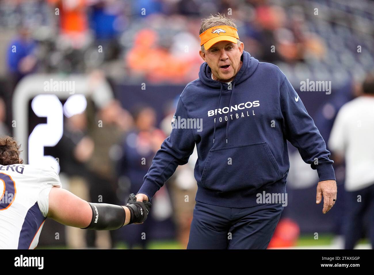 Denver Broncos head coach Sean Payton shakes hands with Broncos center ...