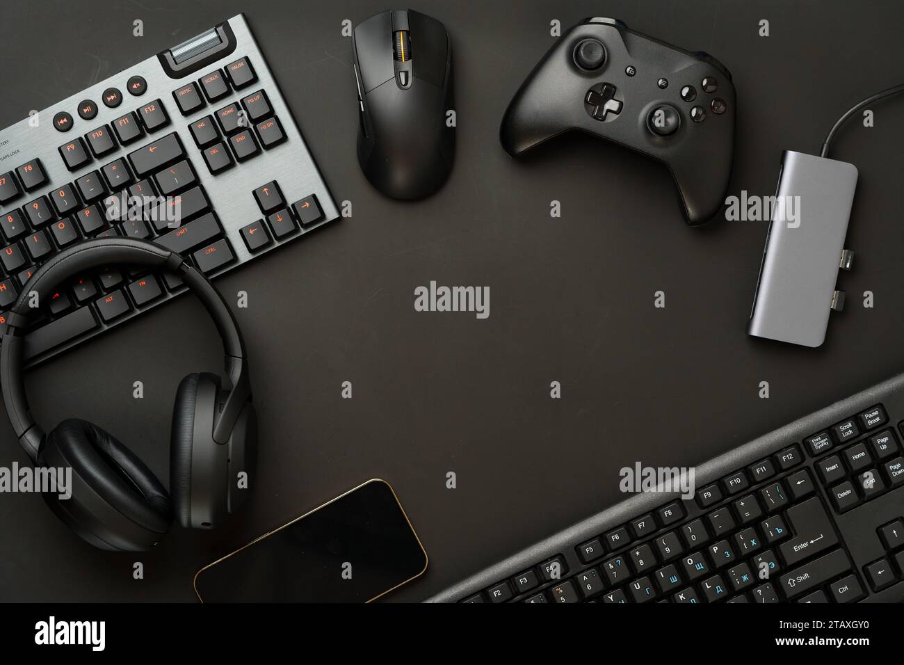 Gaming concept on black background with computer keyboard and joystick ...