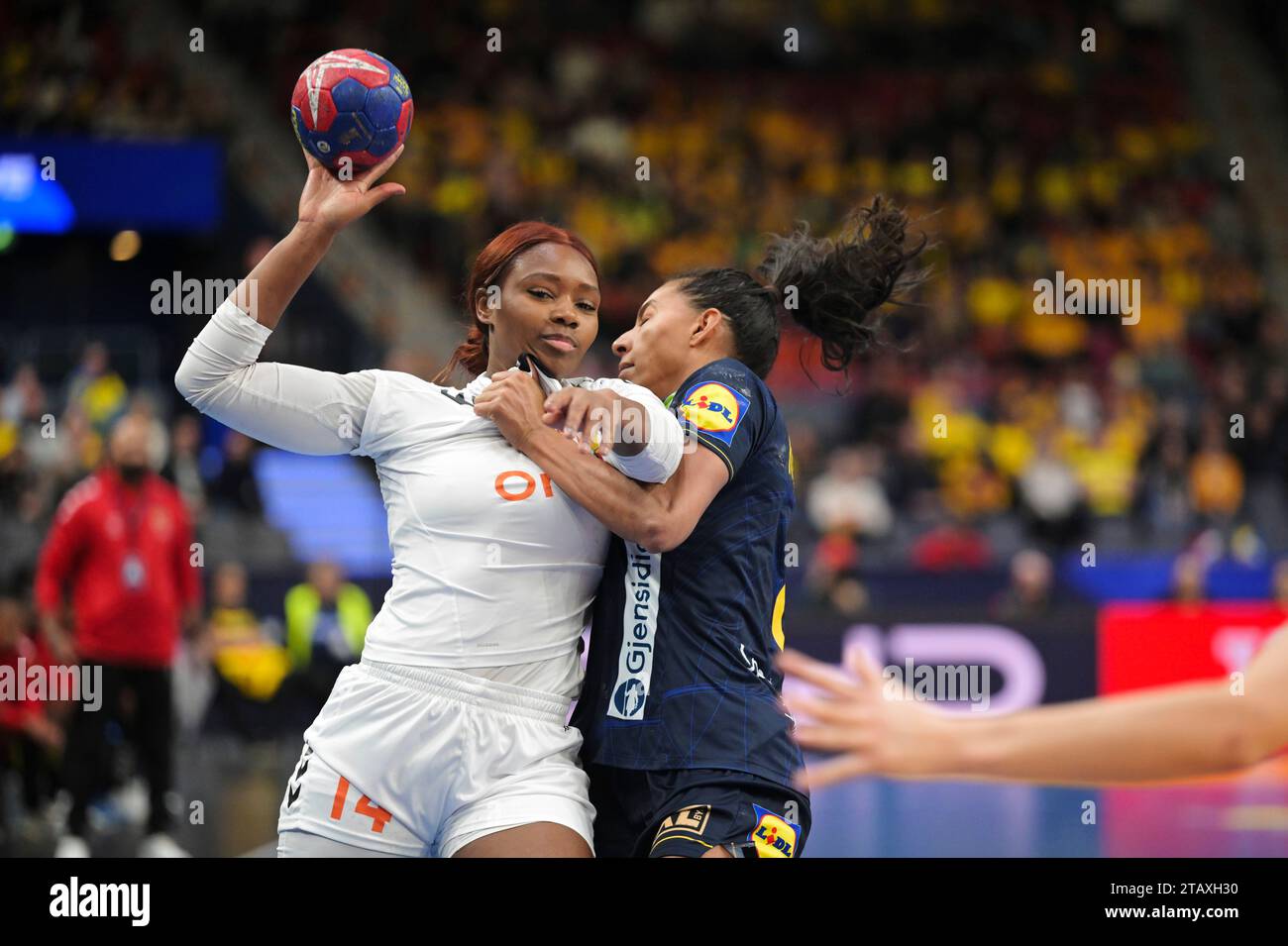 Senegal's Fanta Keita, left, and Sweden's Jamina Roberts in action ...