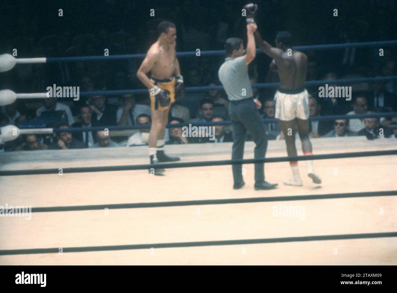 JULY, 1963: General view of the referee raising the hand of an ...