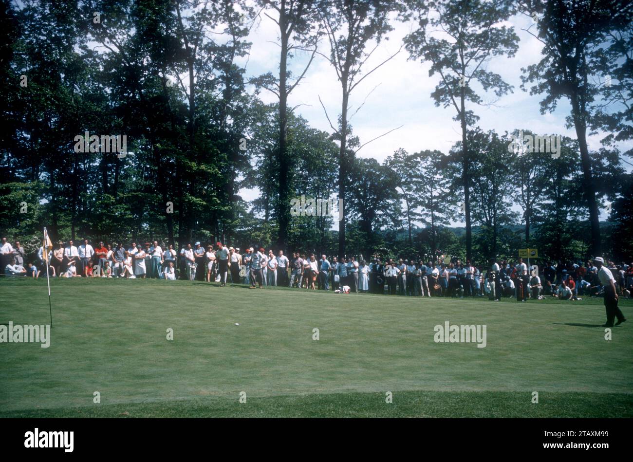 AUGUST, 1958: General view of the crowd as they watch the putted ball ...