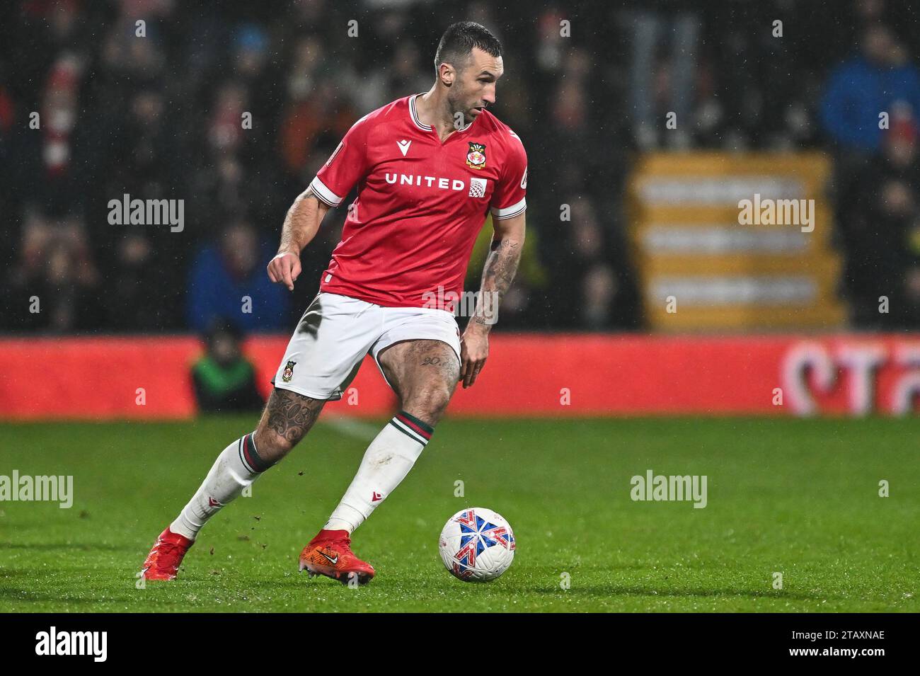 Ollie Palmer #9 of Wrexham makes a break with the ball during the ...