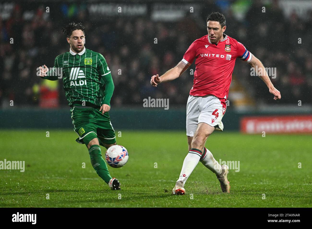 Ben Tozer #4 of Wrexham passes the ball during the Emirates FA Cup ...