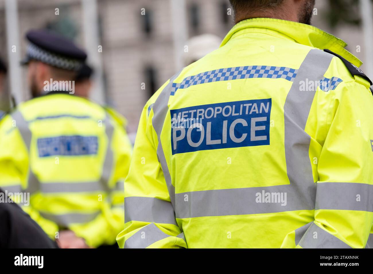 Metropolitan Police sign on the back of a high visibility jacket worn ... Metropolitan Police sign on the back of a high visibility jacket worn ...