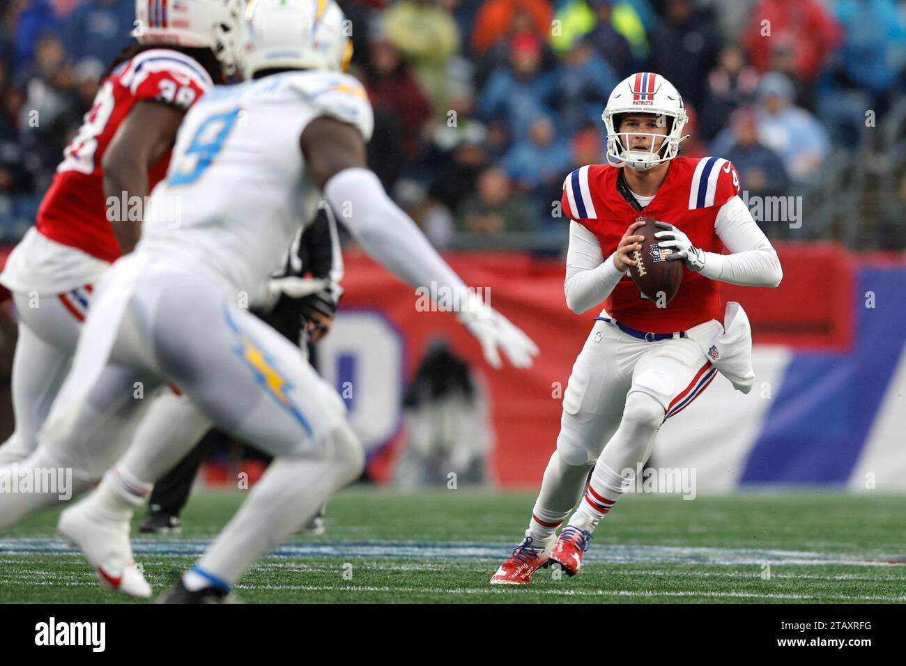 New England Patriots quarterback Bailey Zappe (4) runs for a gain ...