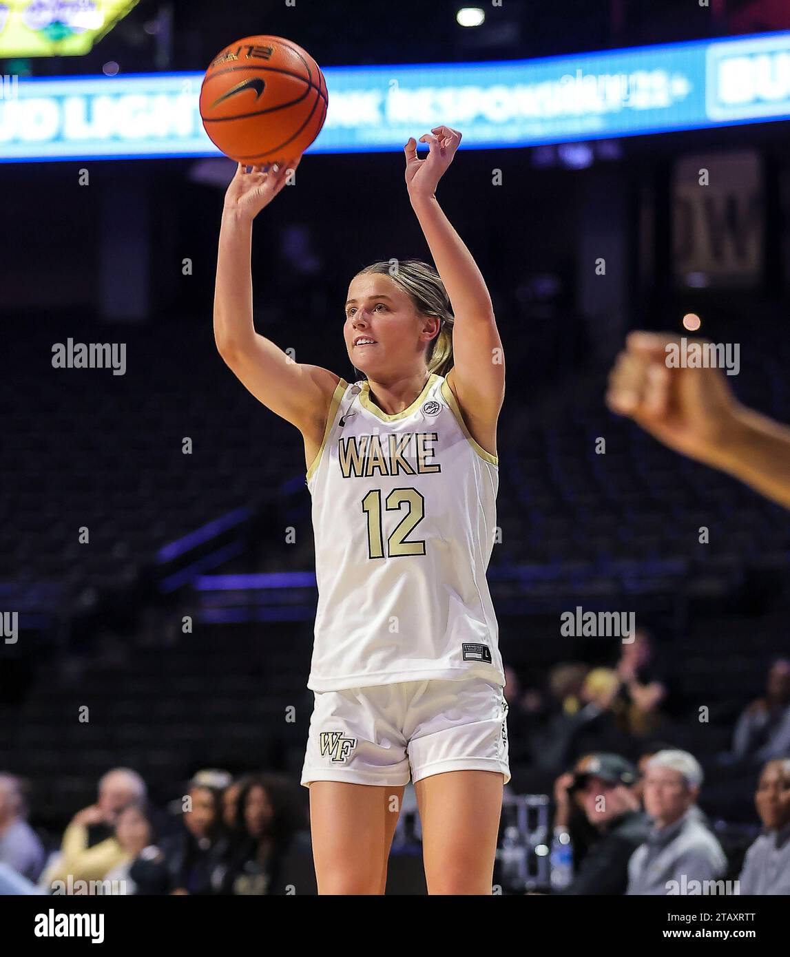 November 30, 2023: Wake Forest freshman Kate Deeble (12) takes 3 point ...