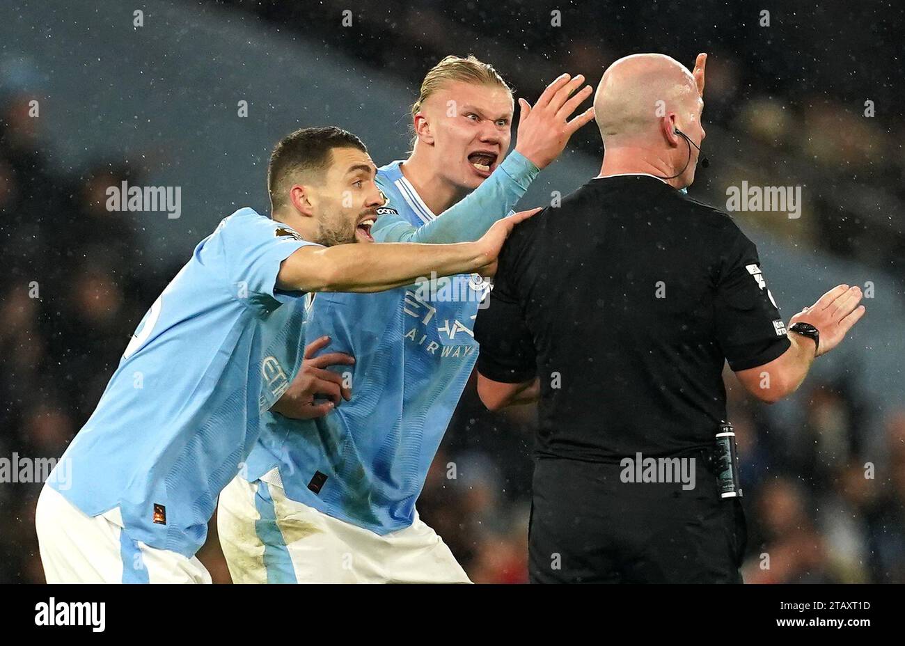 Manchester City's Erling Haaland and Mateo Kovacic (left) react after ...