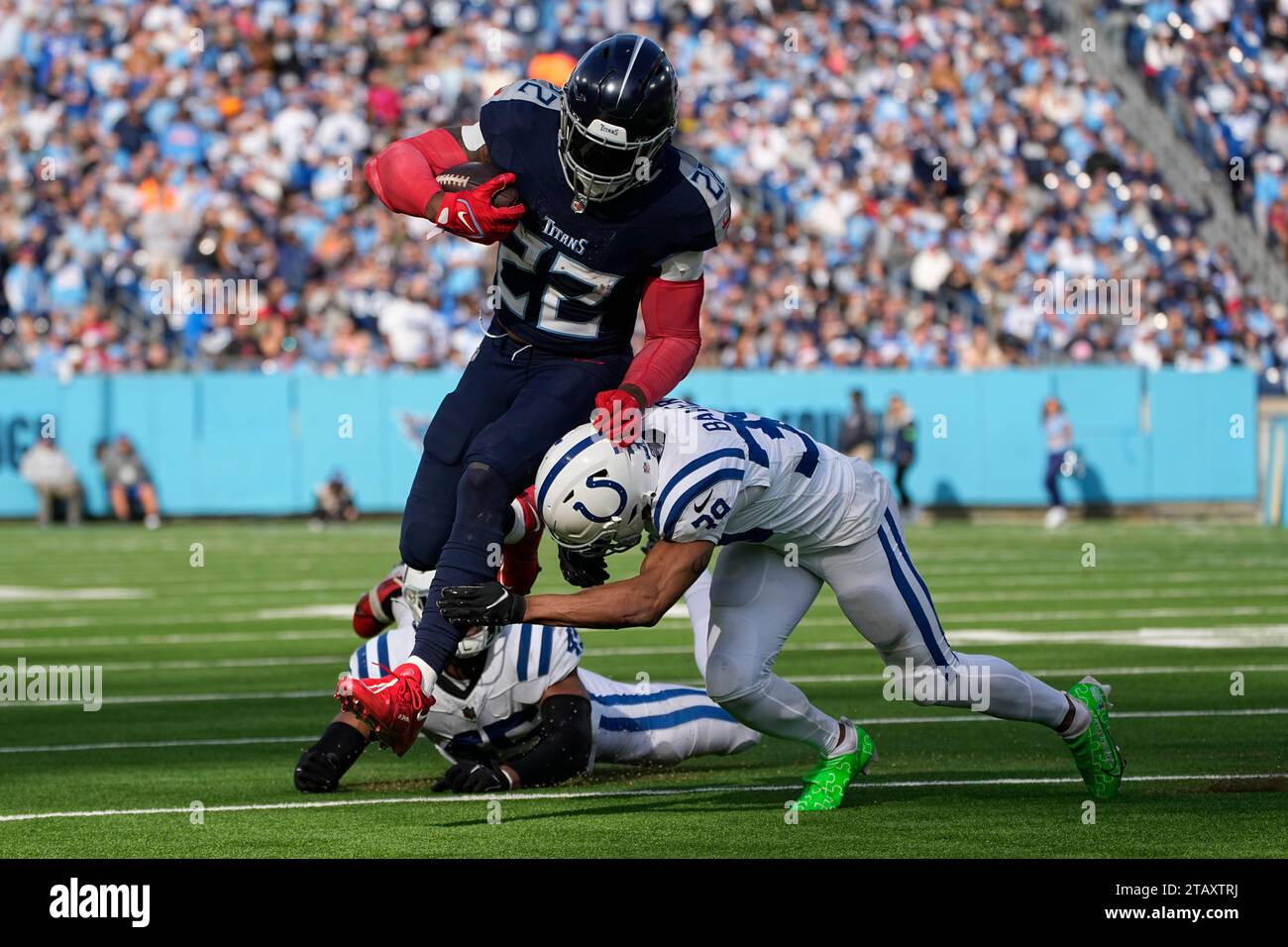 Tennessee Titans' Derrick Henry (22) is tackled by Indianapolis Colts ...