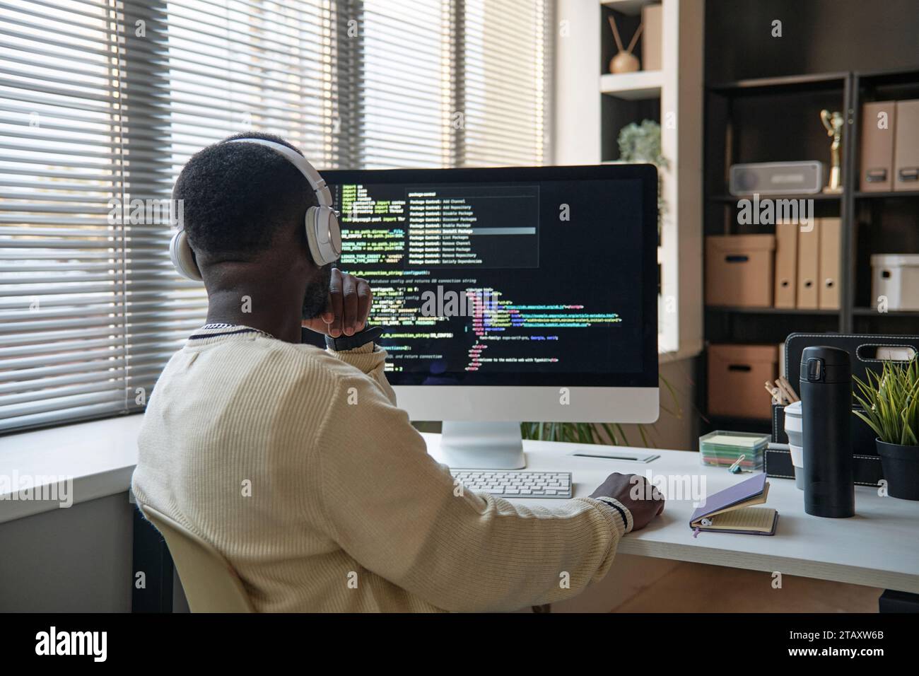 Pensive software developer searching way to fix bugs in programming code Stock Photo - Alamy