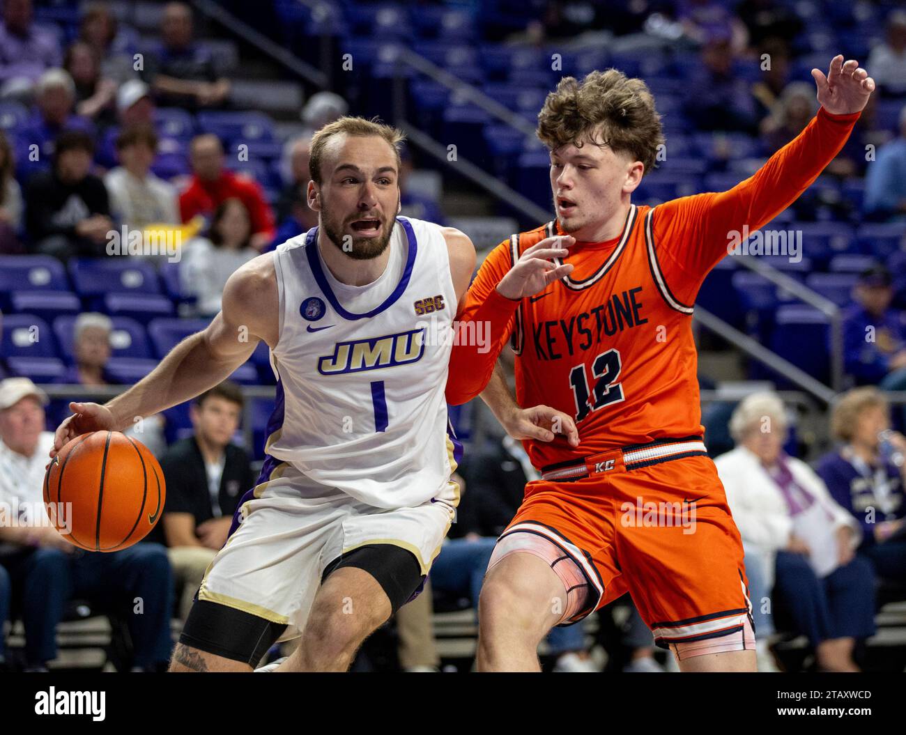 James Madison guard Noah Freidel (1) drives into the paint against ...