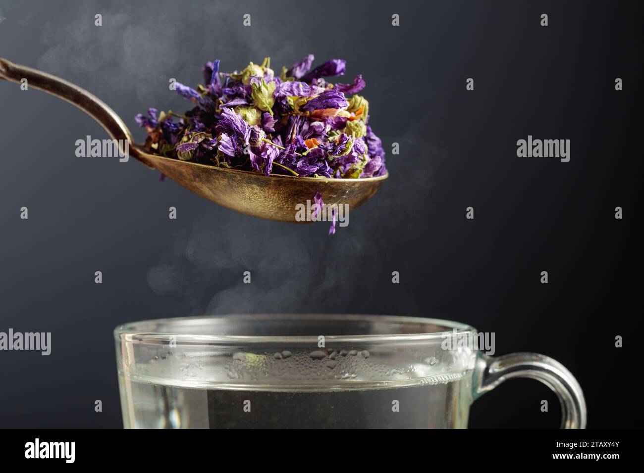Dried mallow flowers for making herbal tea and mug with hot water Stock ...