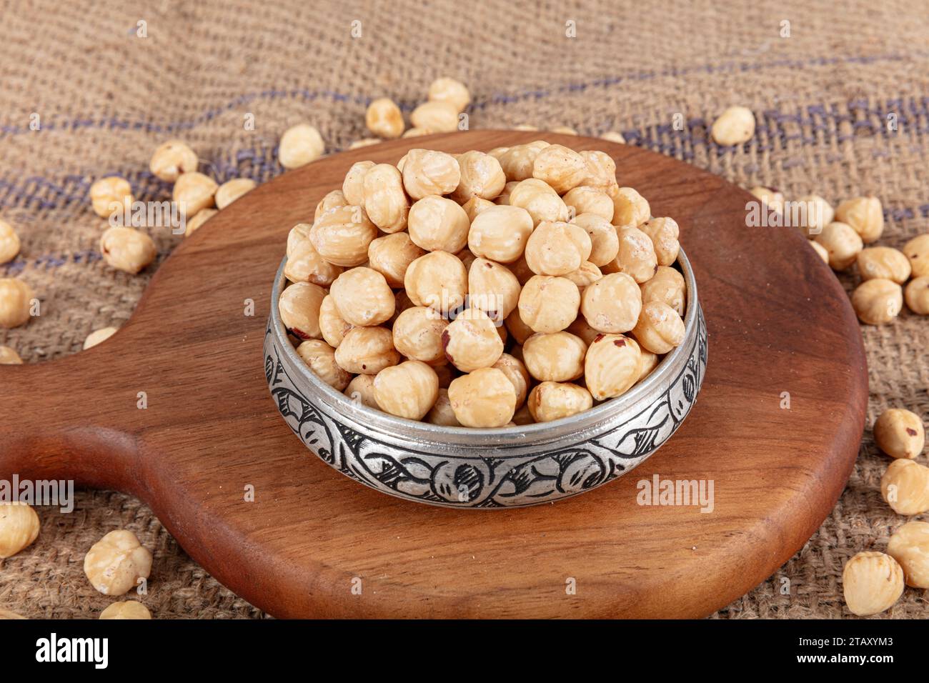 Hazelnut varieties in copper bowl on linen background. Roasted shelled ...