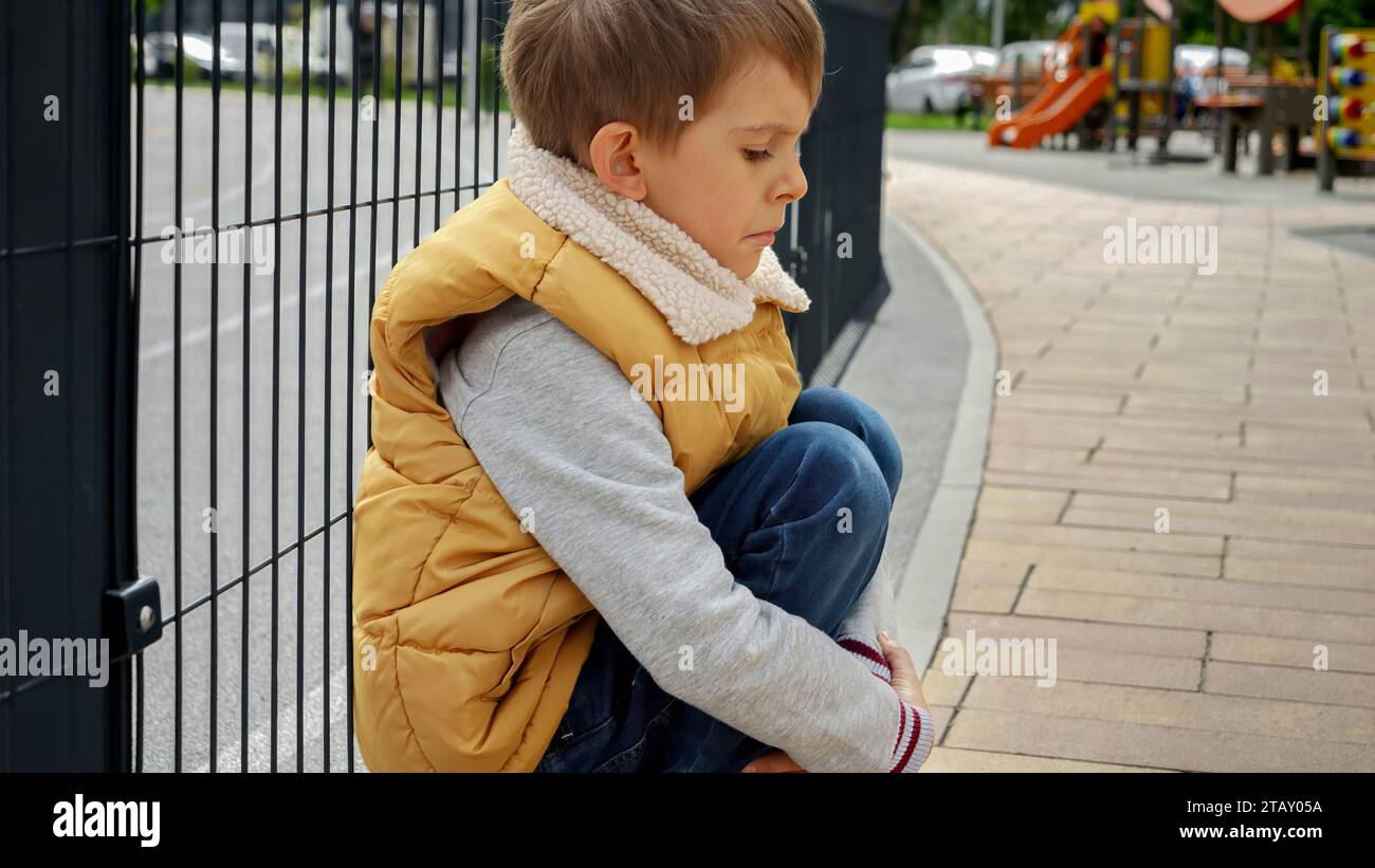 Boy crying in playground hi-res stock photography and images - Alamy