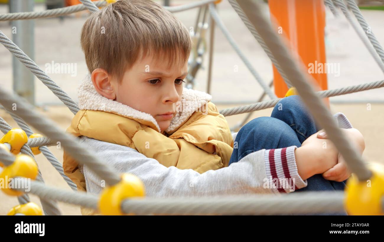 Boy crying in playground hi-res stock photography and images - Alamy