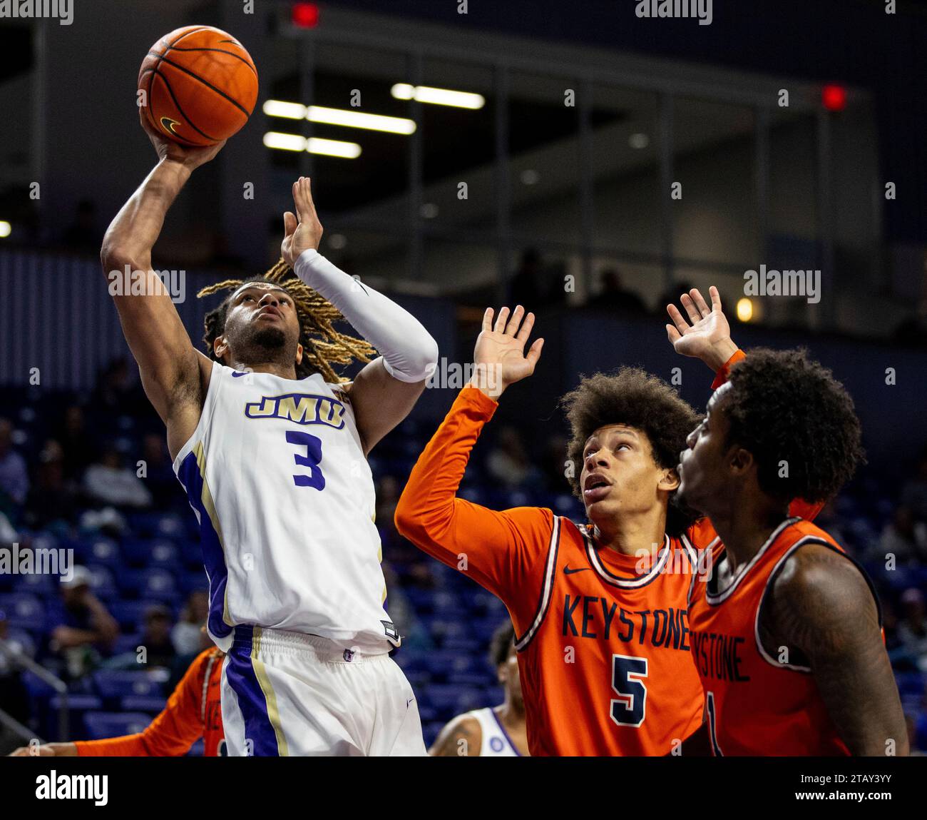 James Madison forward T.J. Bickerstaff (3) goes up for a shot against ...