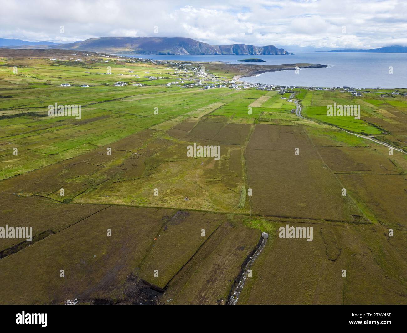Aerial view of bogs, farm fields, village and ocean, Slievemore, Achill ...