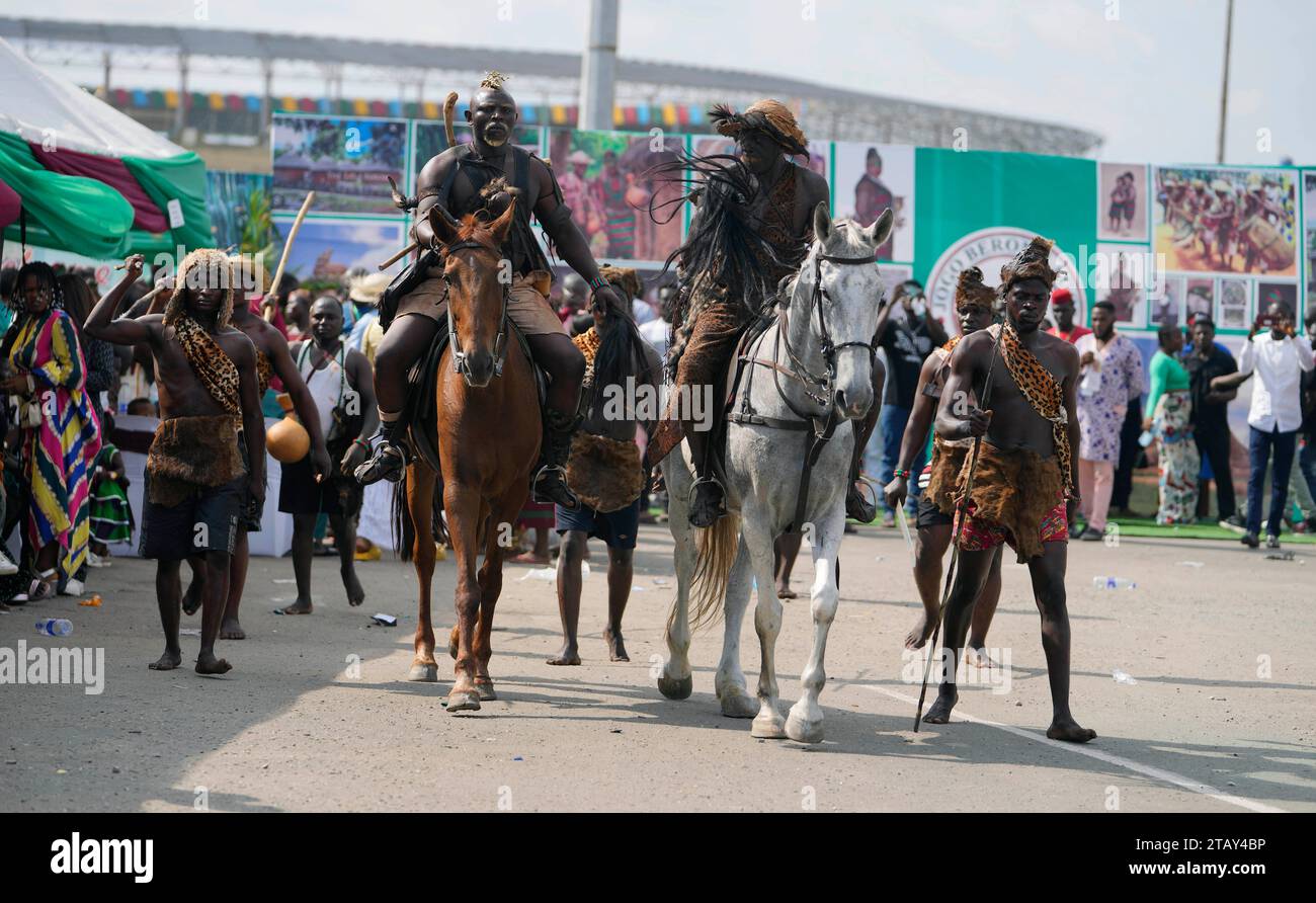Men dressed in traditional clothes ride on horseback, during the annual ...