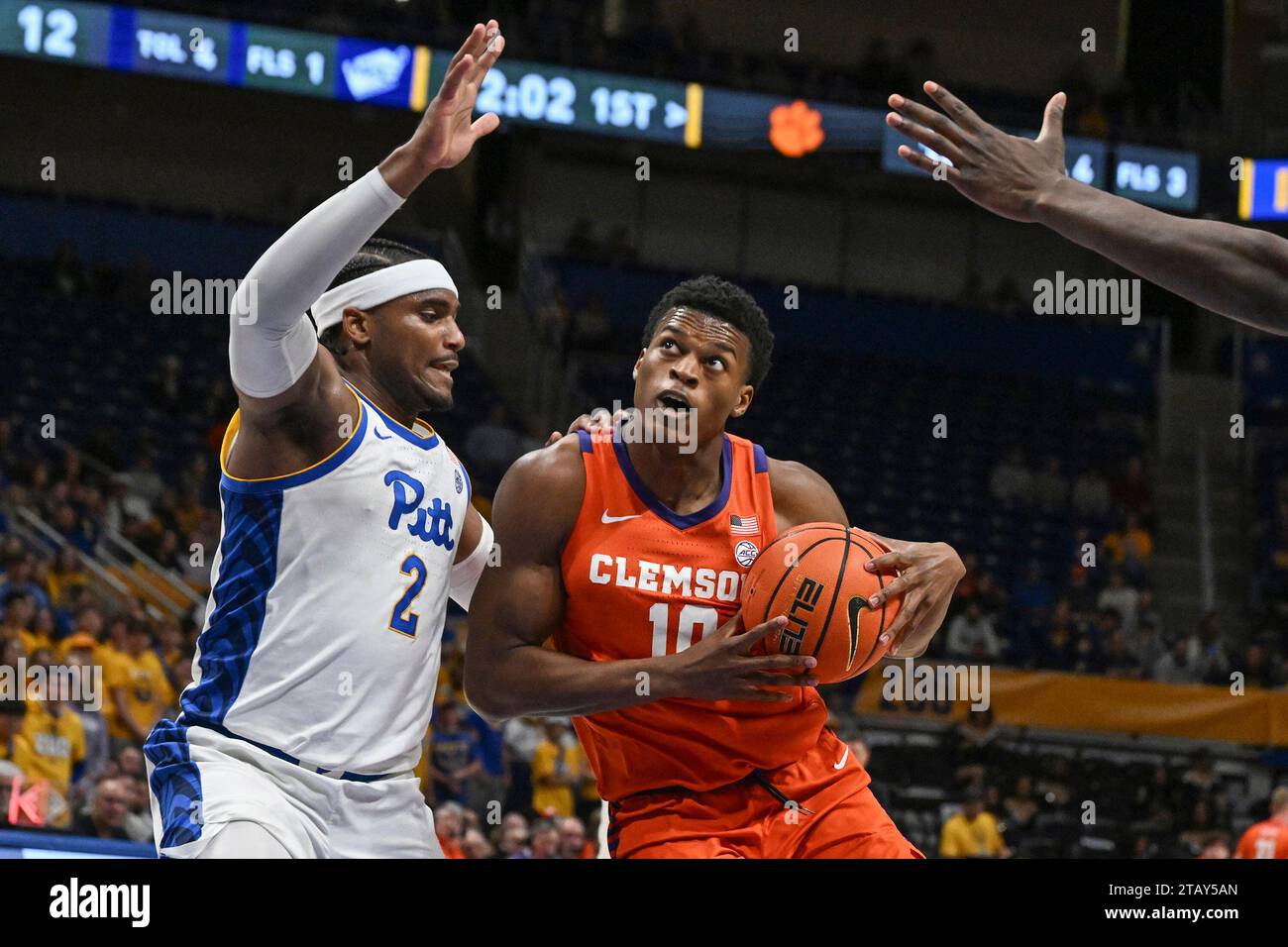 Clemson forward RJ Godfrey (10) drives past Pittsburgh's Blake Hinson ...