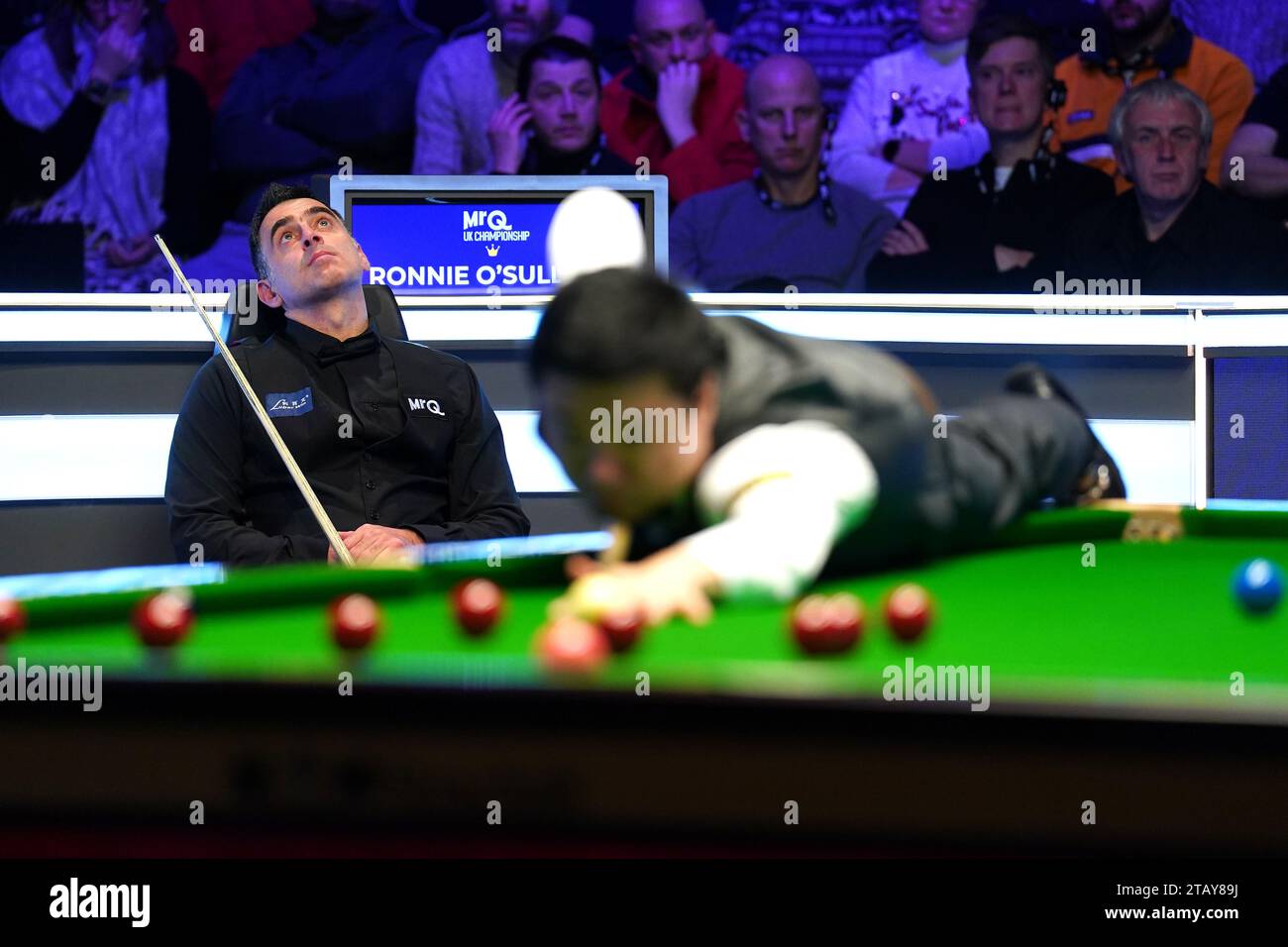 Ronnie O'Sullivan (left) looks on as Ding Junhui plays a shot in the ...