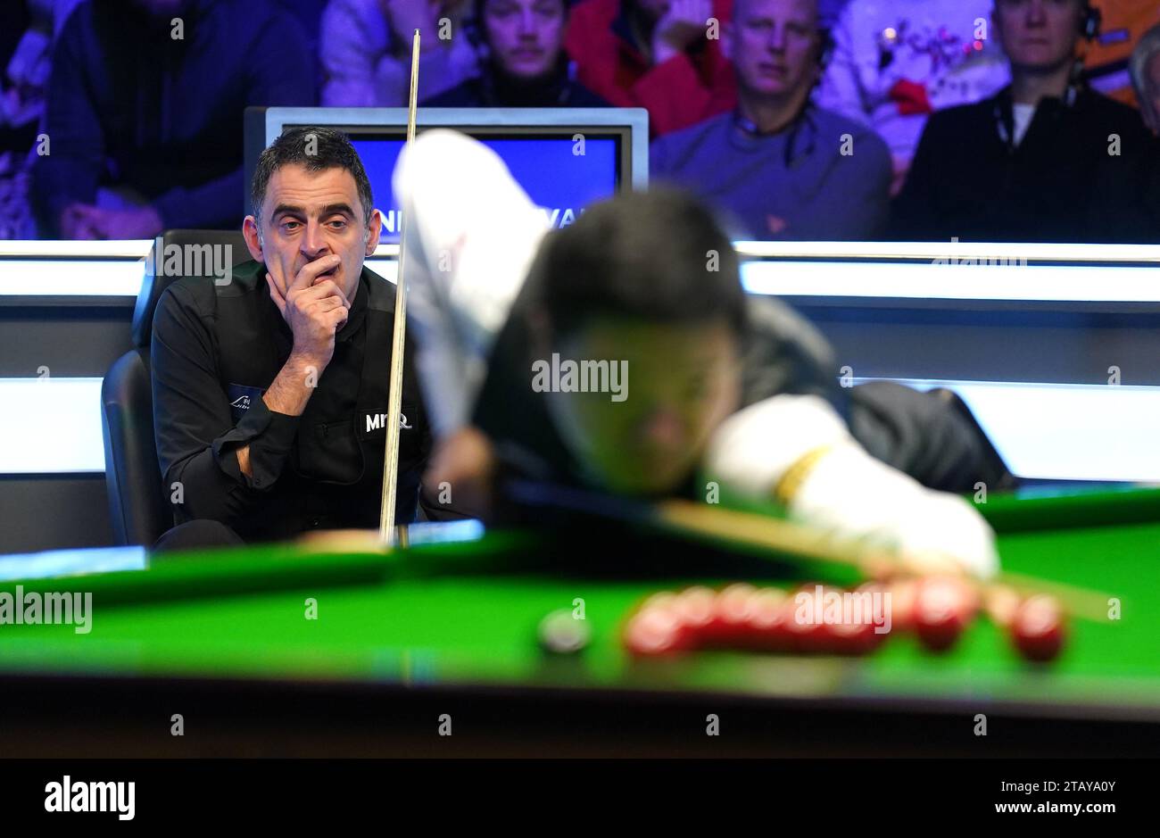 Ronnie O'Sullivan (left) looks on as Ding Junhui plays a shot in the ...