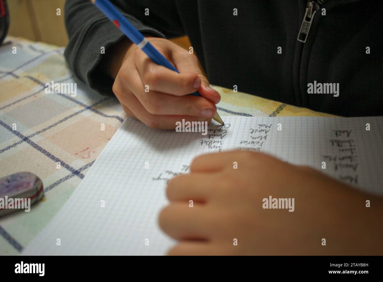 Focused Learning: Child Engaged in Homework Stock Photo - Alamy