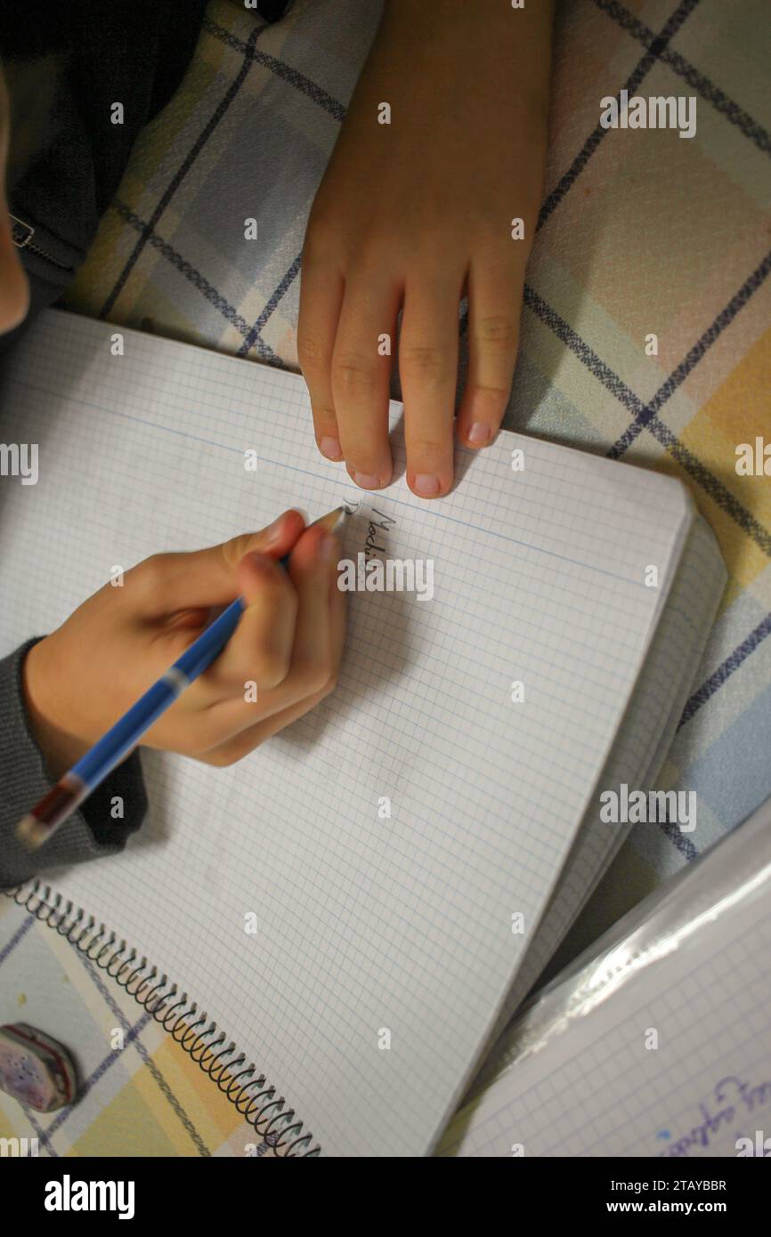 Child writing with pencil hi-res stock photography and images - Alamy